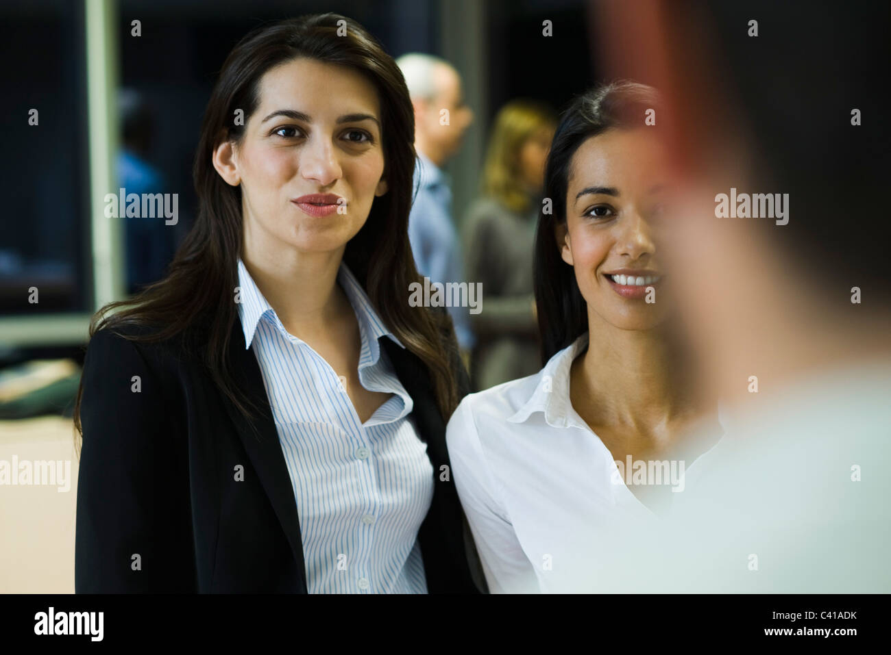Colleagues talking in office Stock Photo - Alamy