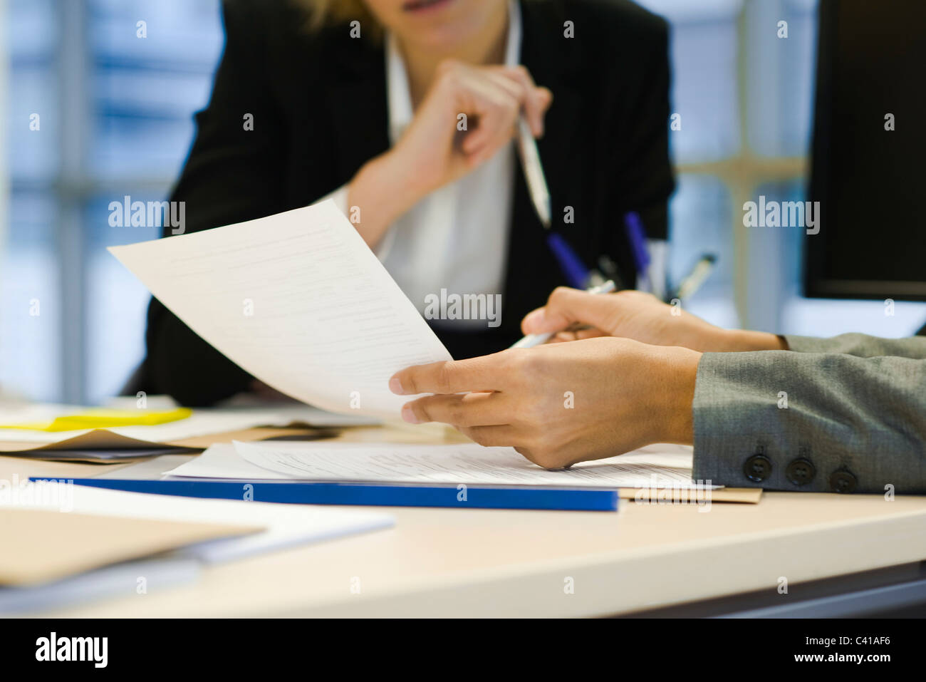 Cropped shot businesspeople documents hi-res stock photography and ...