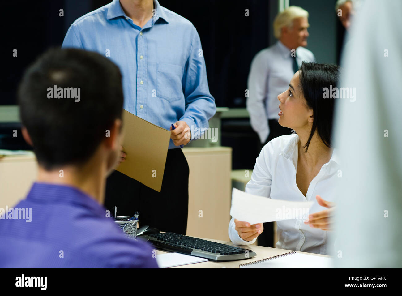 Office night workers talking hi-res stock photography and images - Alamy