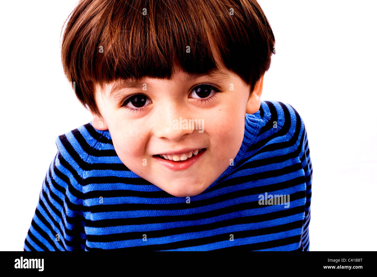 Happy young boy wearing blue striped top Stock Photo - Alamy