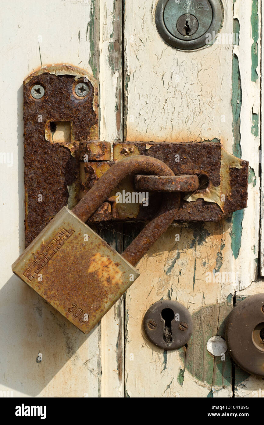 Close up old rusty padlock on a door Stock Photo - Alamy