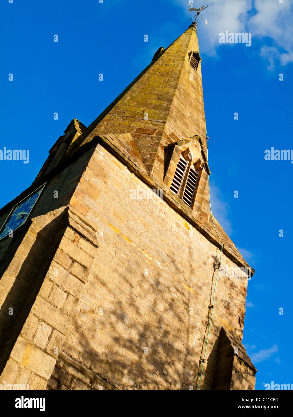 The fourteenth century tower of the church of St Anne in Baslow ...