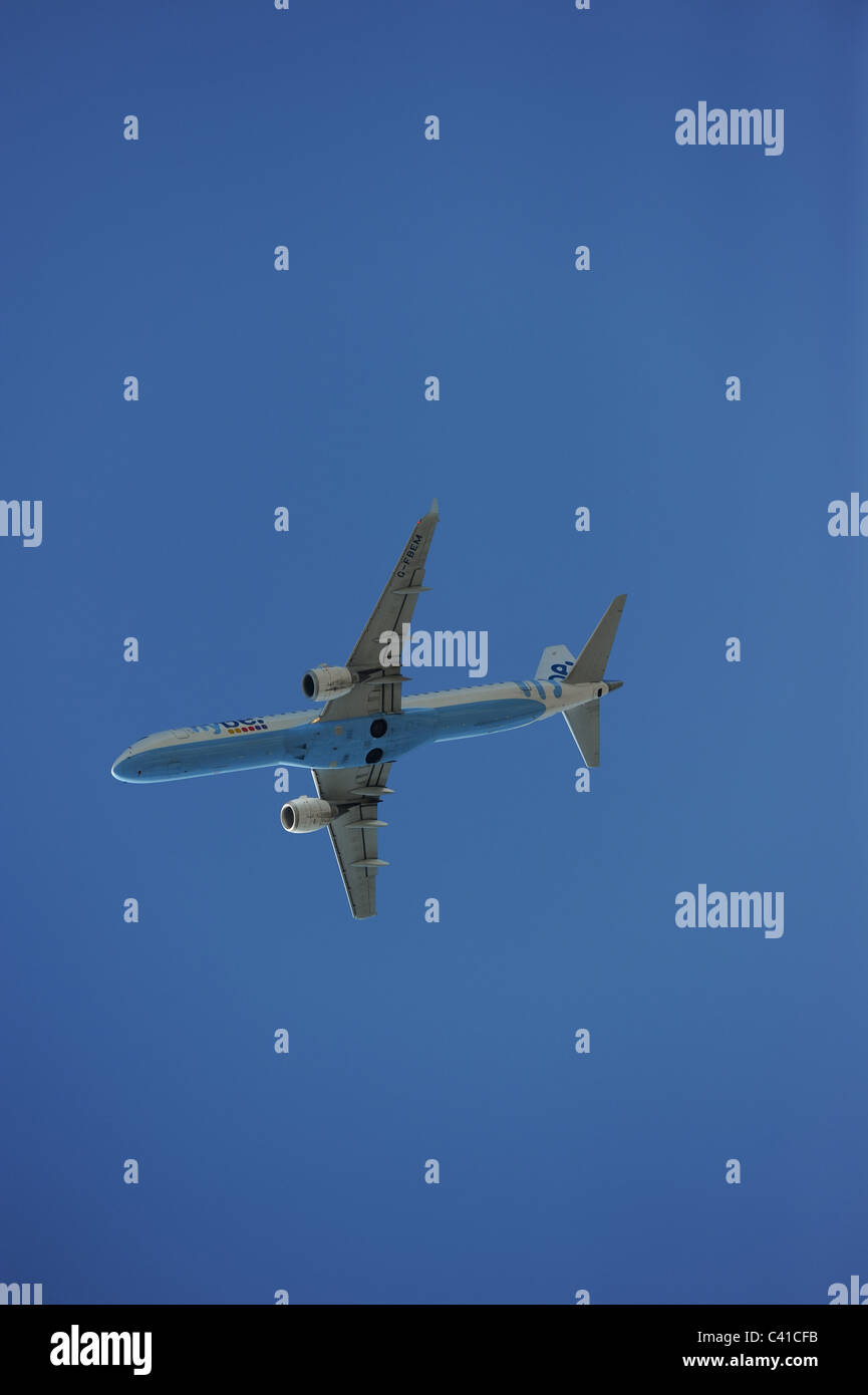 A Flybe jet plane against a clear blue sky Stock Photo - Alamy