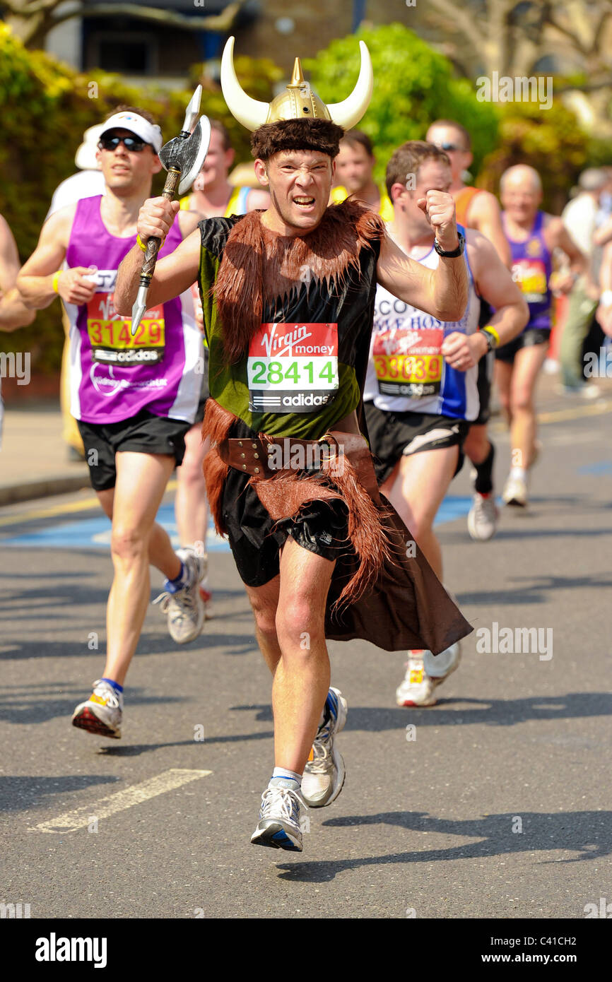 Runners take part in the Virgin 2011 London Marathon seen here at 14 ...