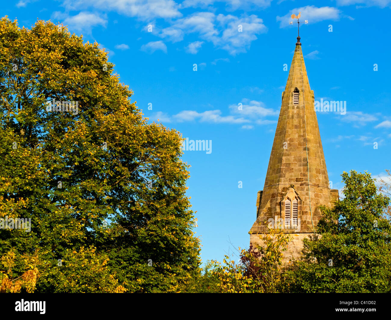 The fourteenth century tower of the church of St Anne in Baslow ...