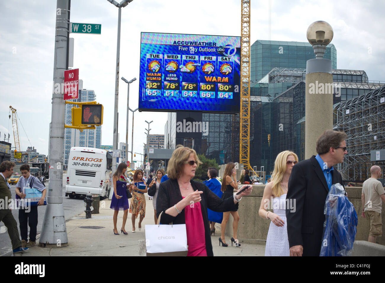 A giant illuminated billboard displays the five-day weather forecast ...
