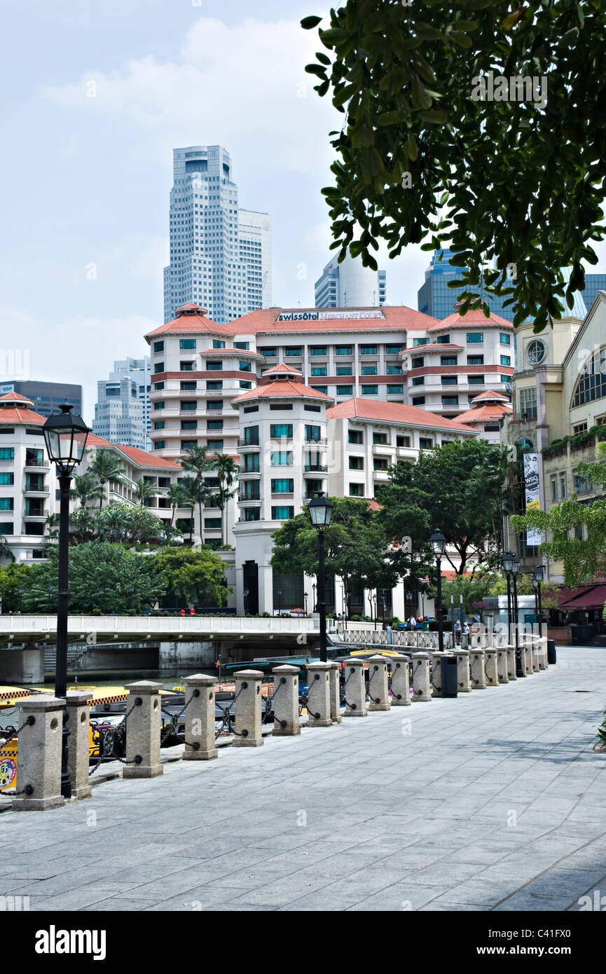 Swissotel Merchant Court with The City Skyscrapers Behind and Boats on ...