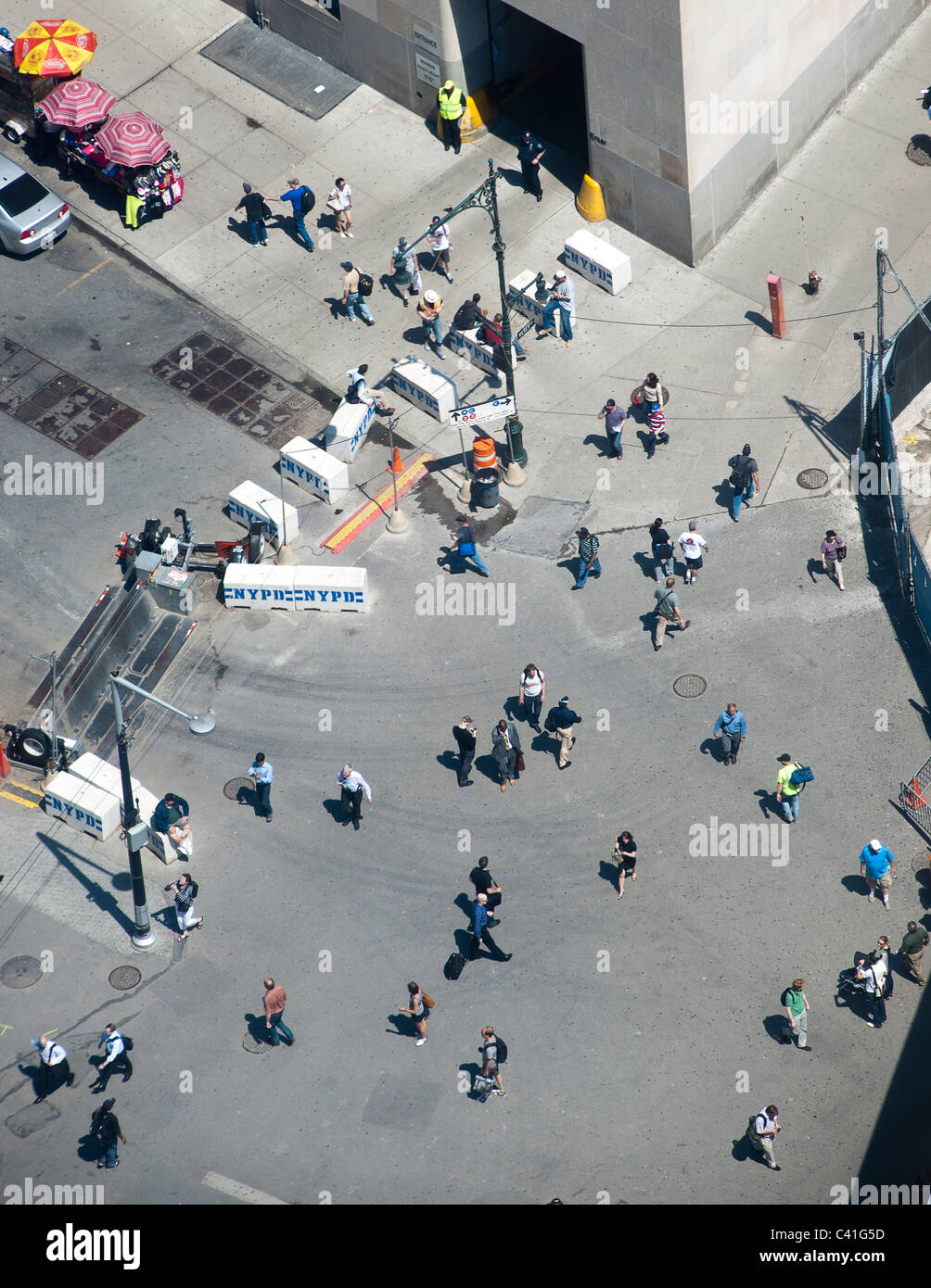 Pedestrians look like ants as they walk on Vesey Street next to the ...