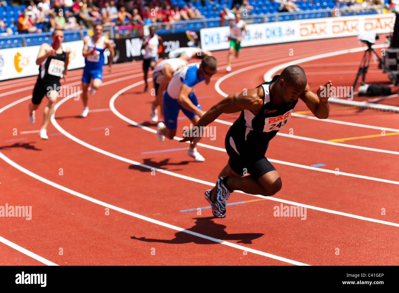 High resolution image of some sprinters starting to take the baton at ...