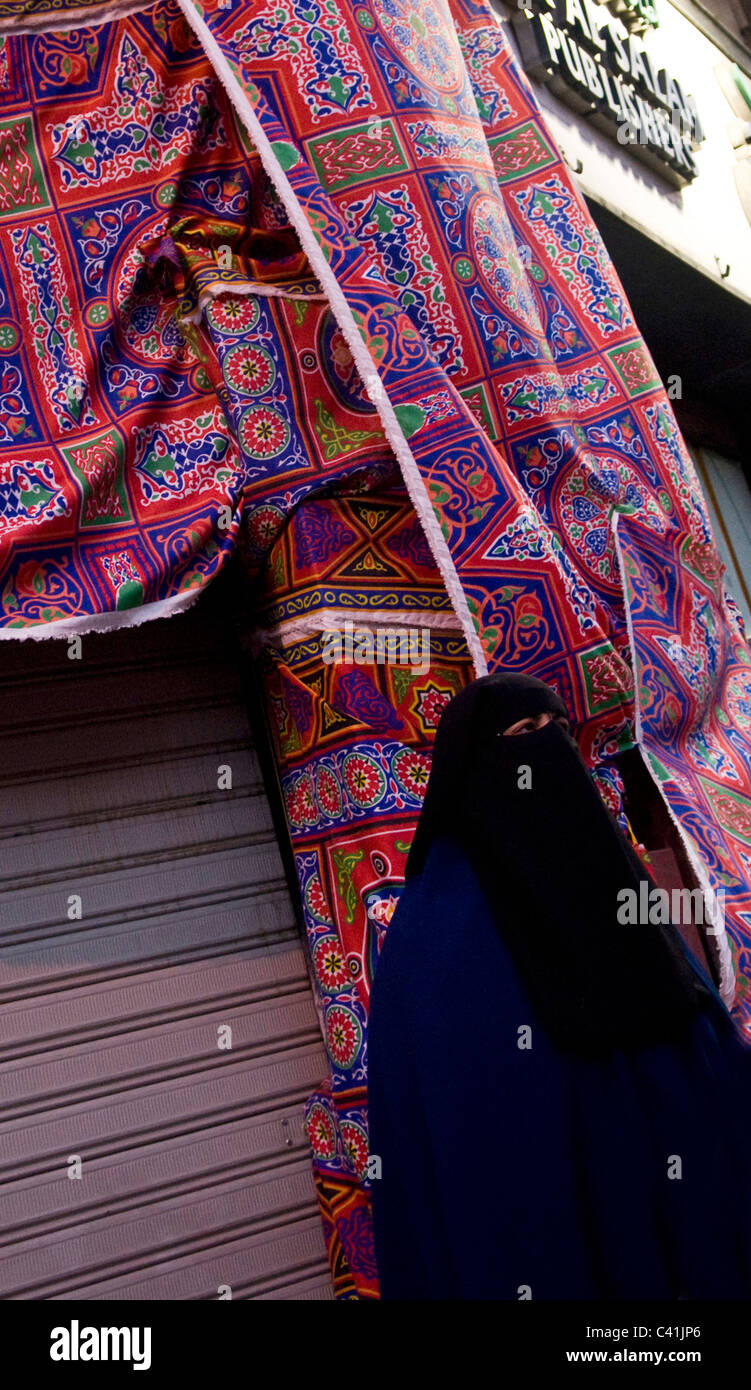 Covered from head to toe. A Muslim woman wearing a Burqa and a ...