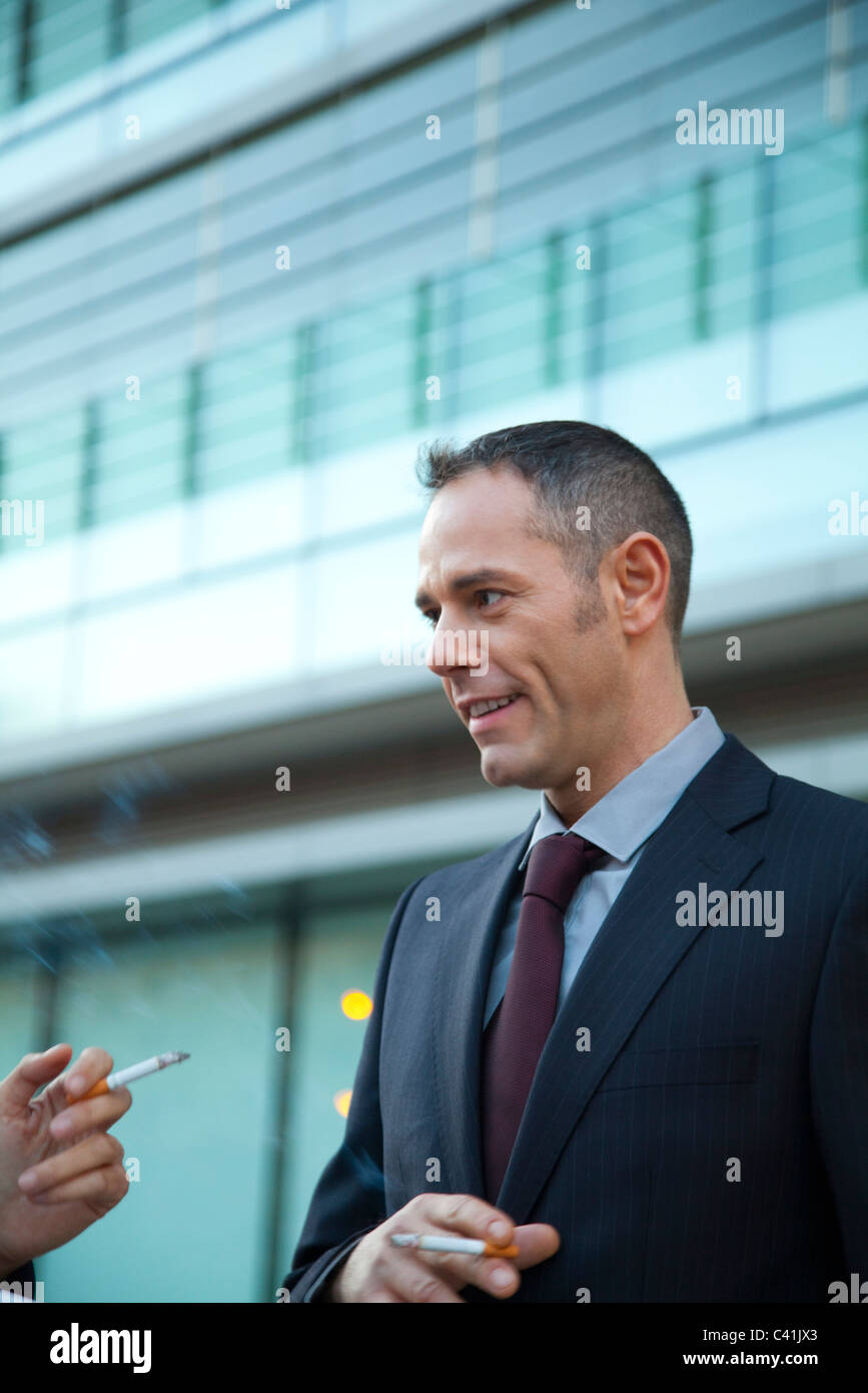 Two smokers outside hi-res stock photography and images - Alamy