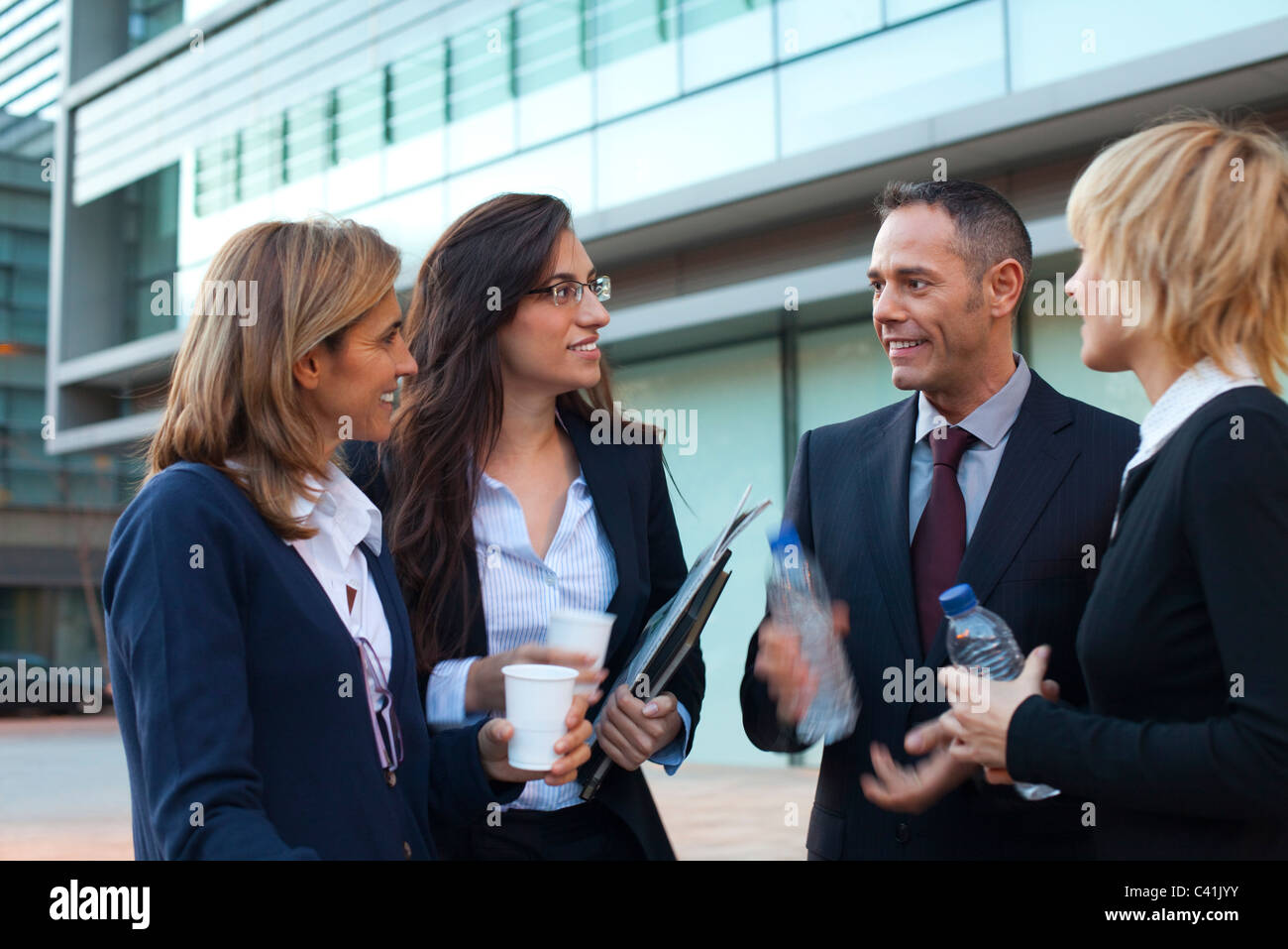 Colleagues taking coffee break outdoors Stock Photo - Alamy