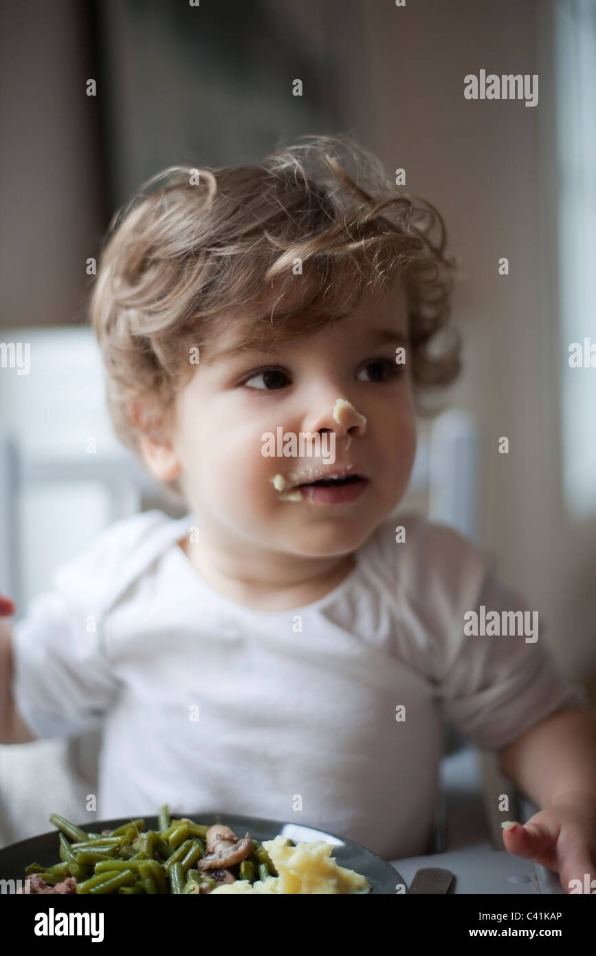 Toddler boy with food on his face, portrait Stock Photo - Alamy