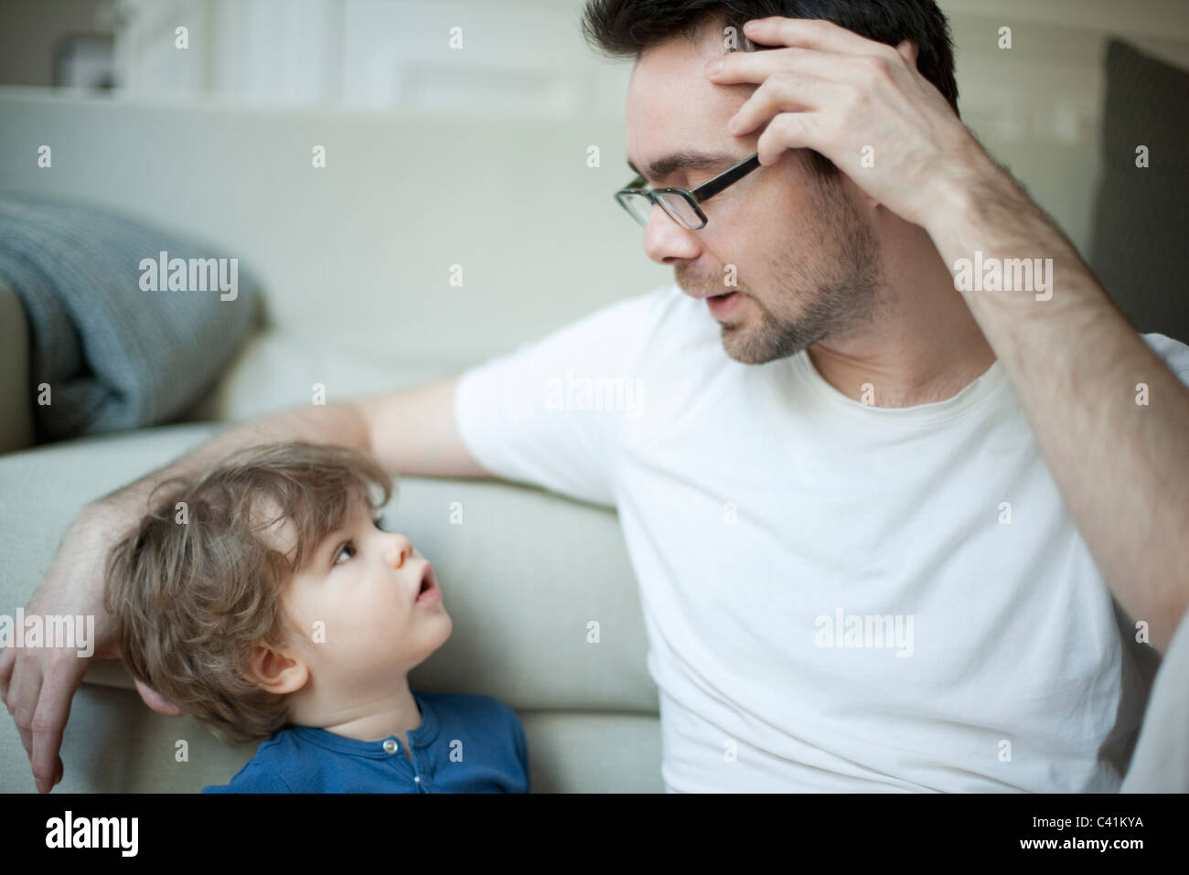 Father talking to young son, portrait Stock Photo - Alamy