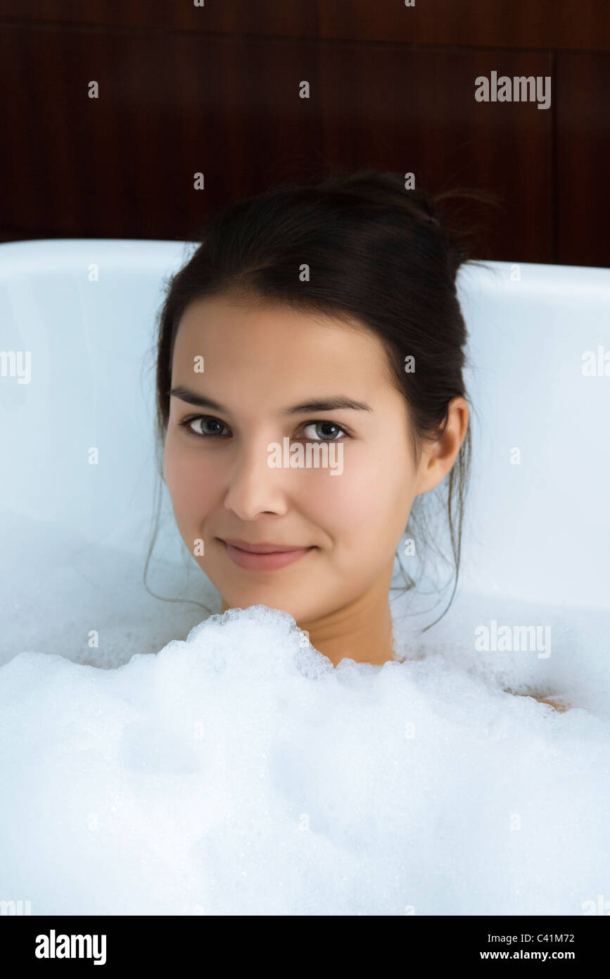 Woman relaxing in bubble bath, portrait Stock Photo - Alamy