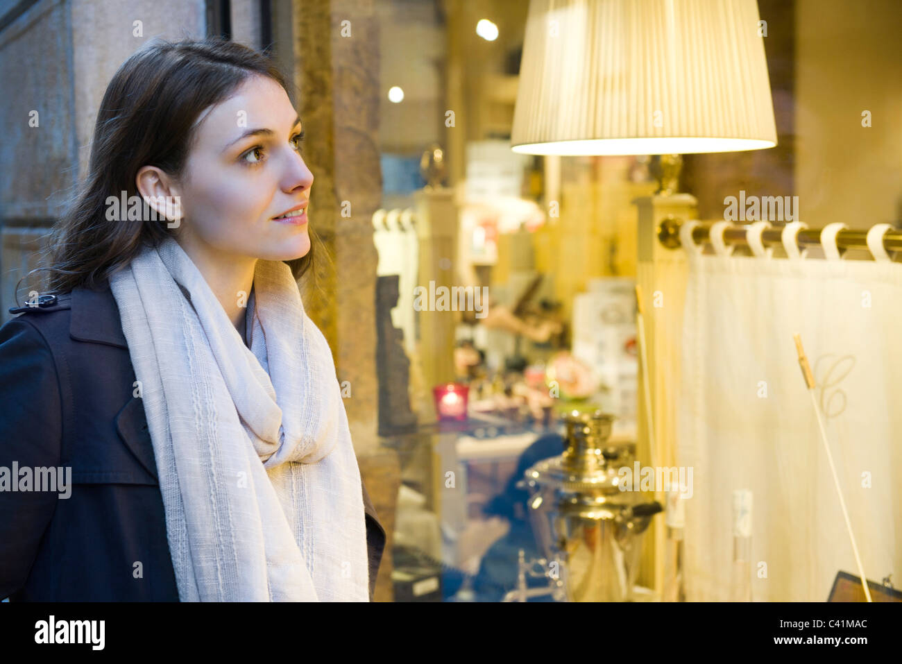 Young woman window shopping Stock Photo - Alamy