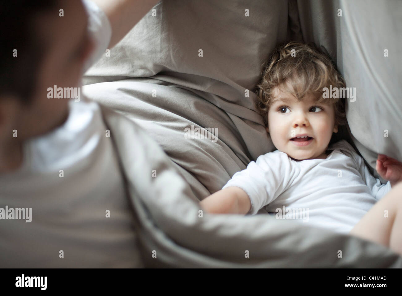 Toddler boy and father in bed Stock Photo - Alamy