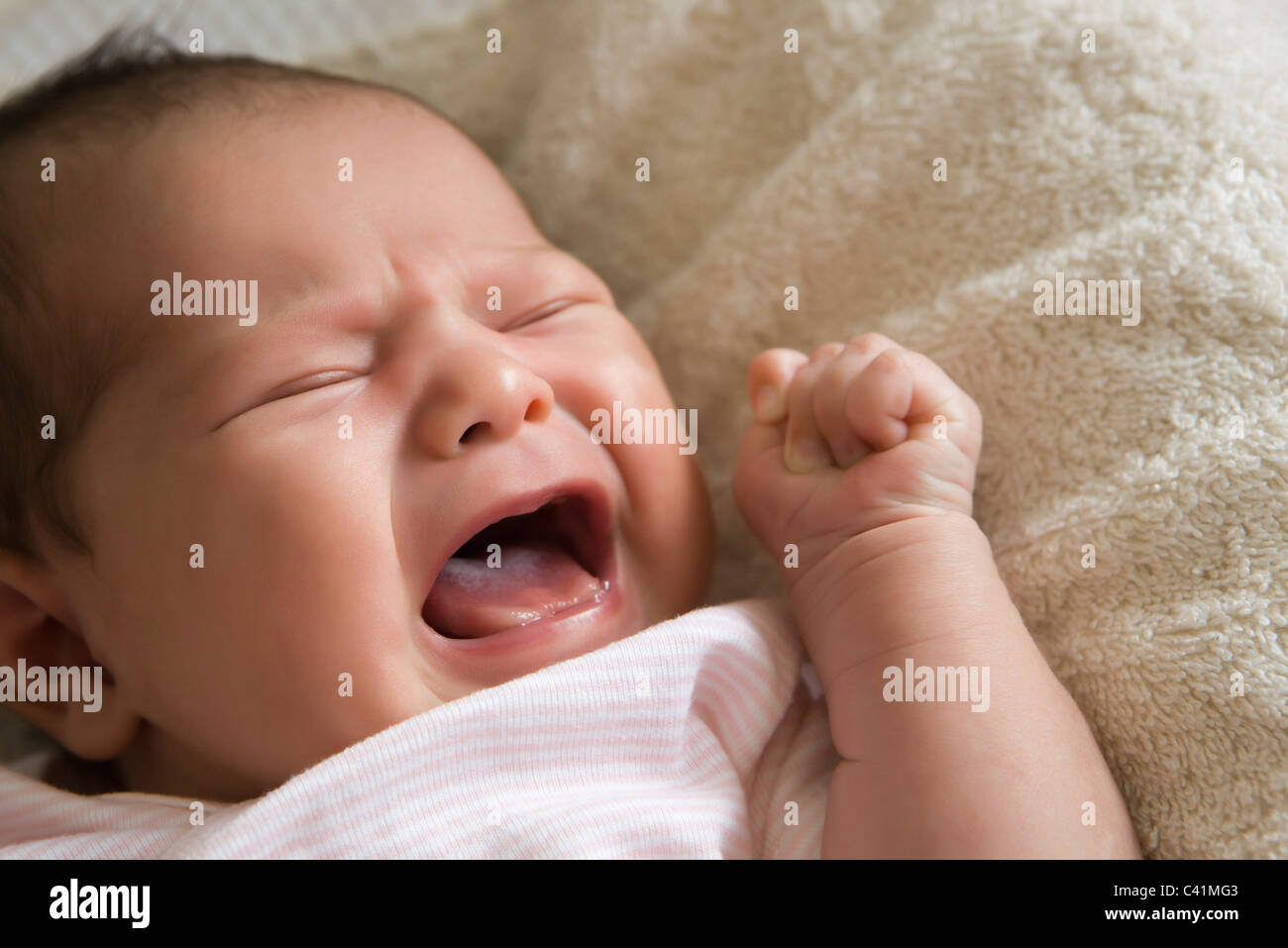 Baby crying, portrait Stock Photo - Alamy