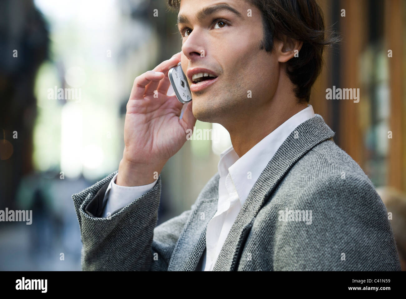Man talking on cell phone outdoors Stock Photo - Alamy