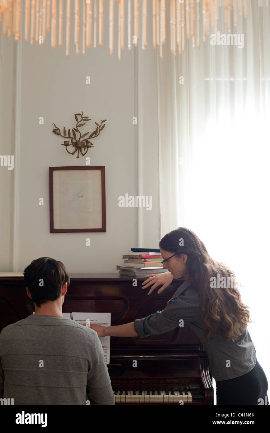 Man taking piano lessons Stock Photo - Alamy