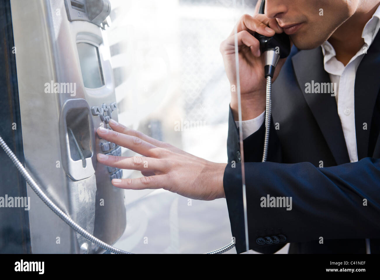 Man using pay phone Stock Photo - Alamy