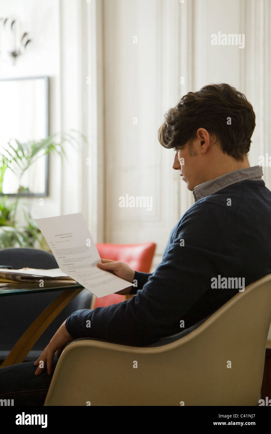 Man reading over employment contract Stock Photo - Alamy