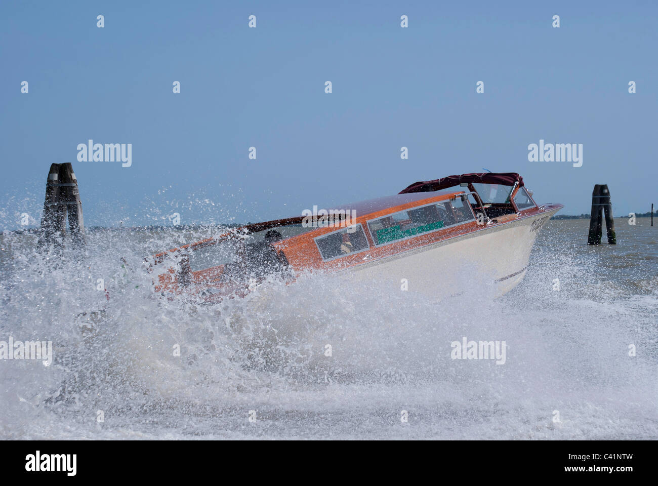 A speeding water taxi heads across the Venetian lagoon Stock Photo - Alamy
