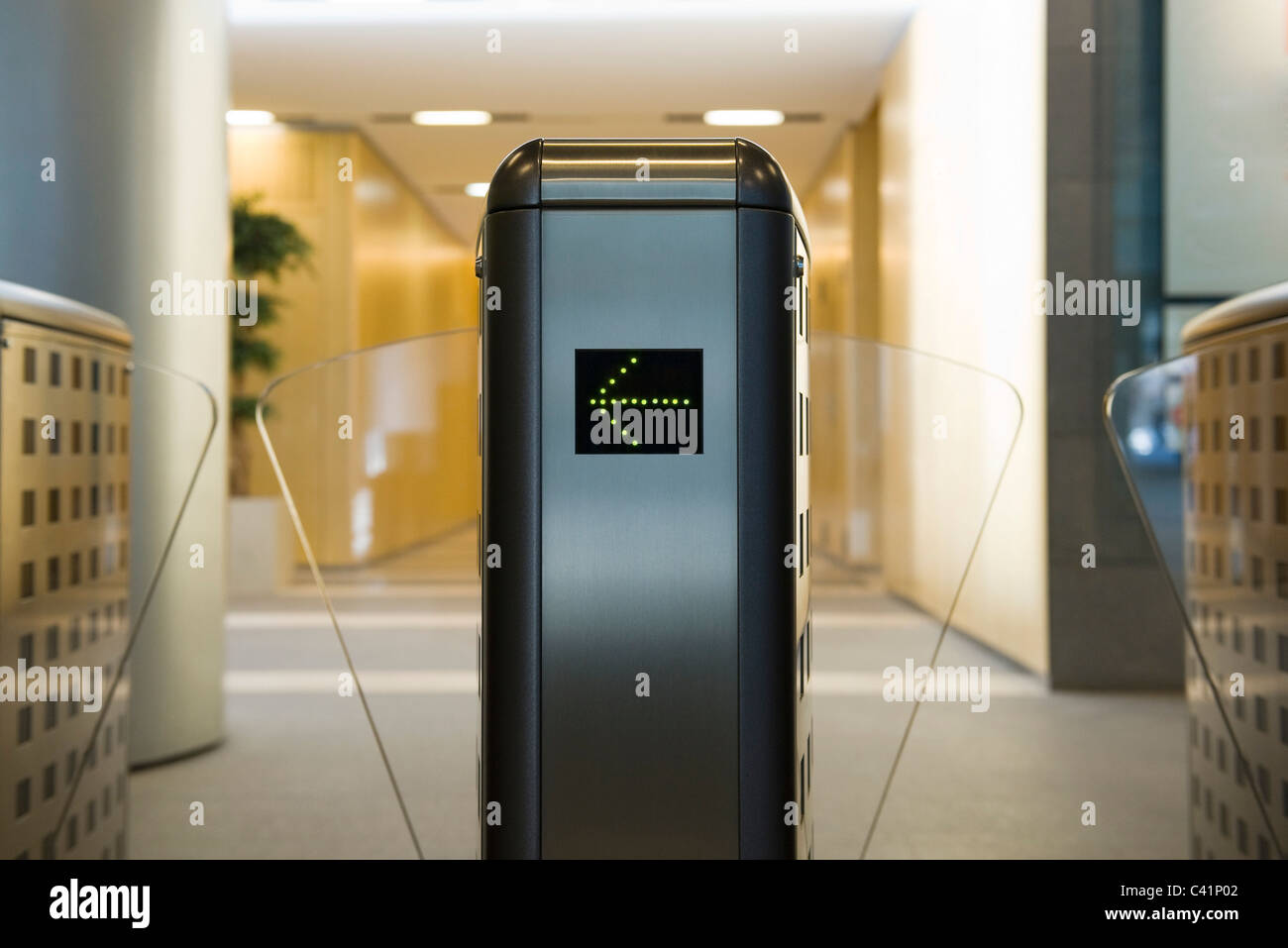 Turnstile in office building lobby Stock Photo - Alamy