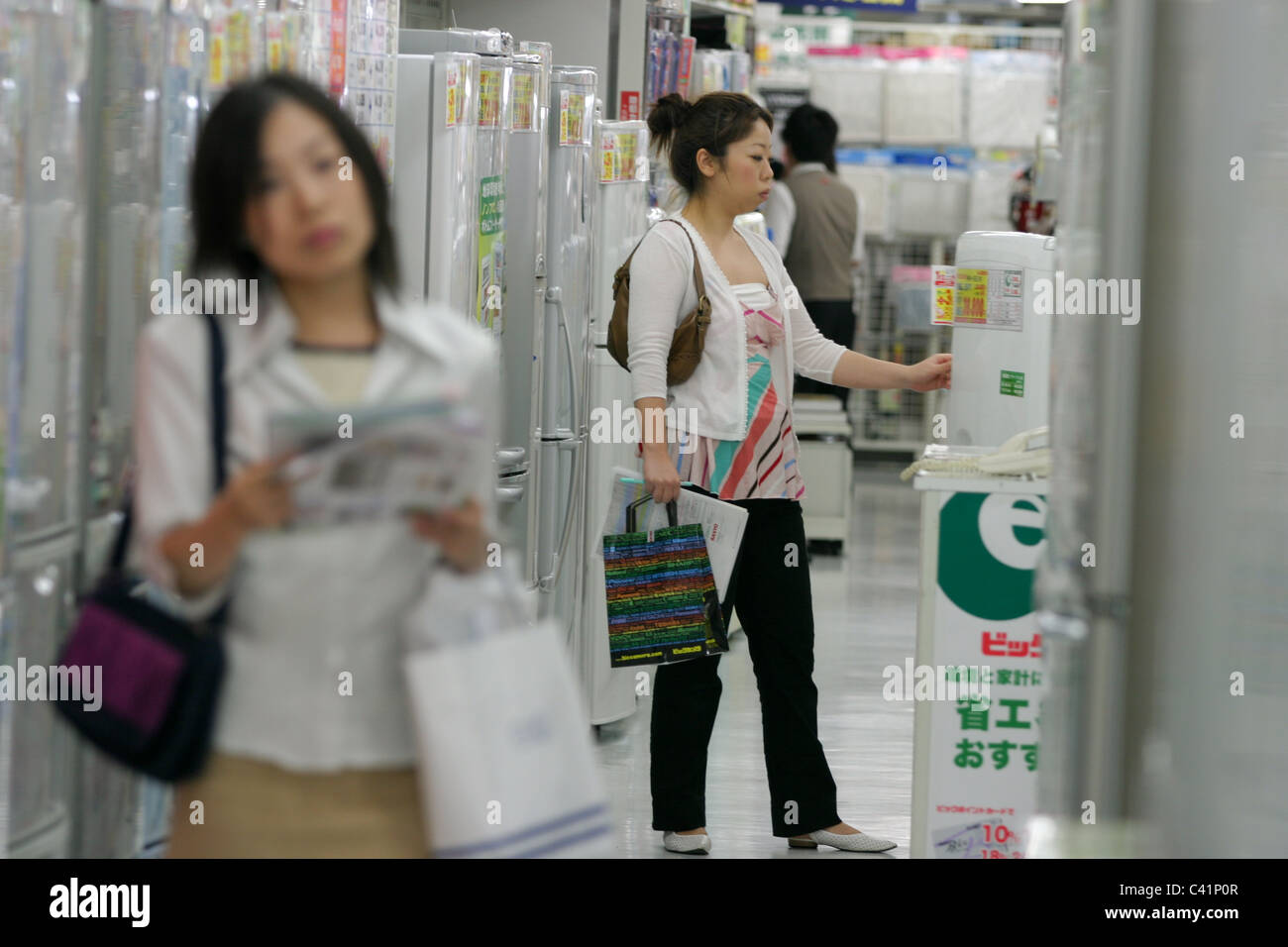 Consumers shopping for white goods and electronics, Tokyo, Japan Stock ...