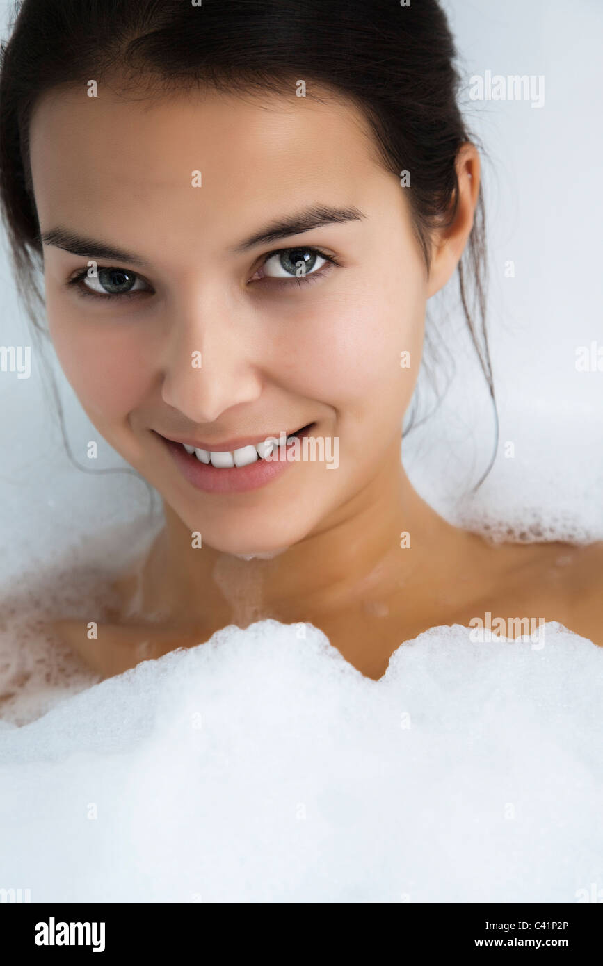 Woman relaxing in bubble bath, portrait Stock Photo - Alamy