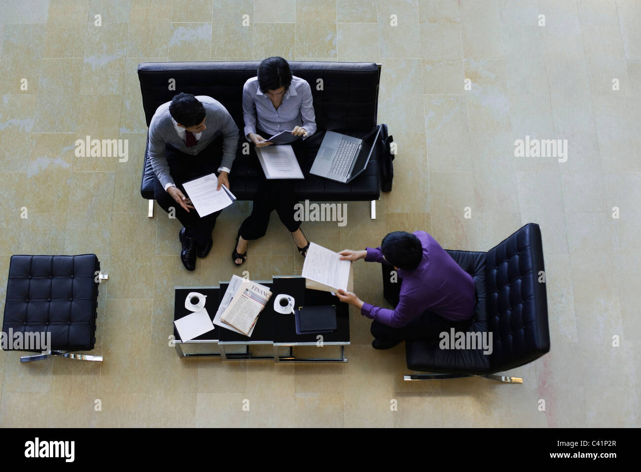 Executives working together, overhead view Stock Photo - Alamy