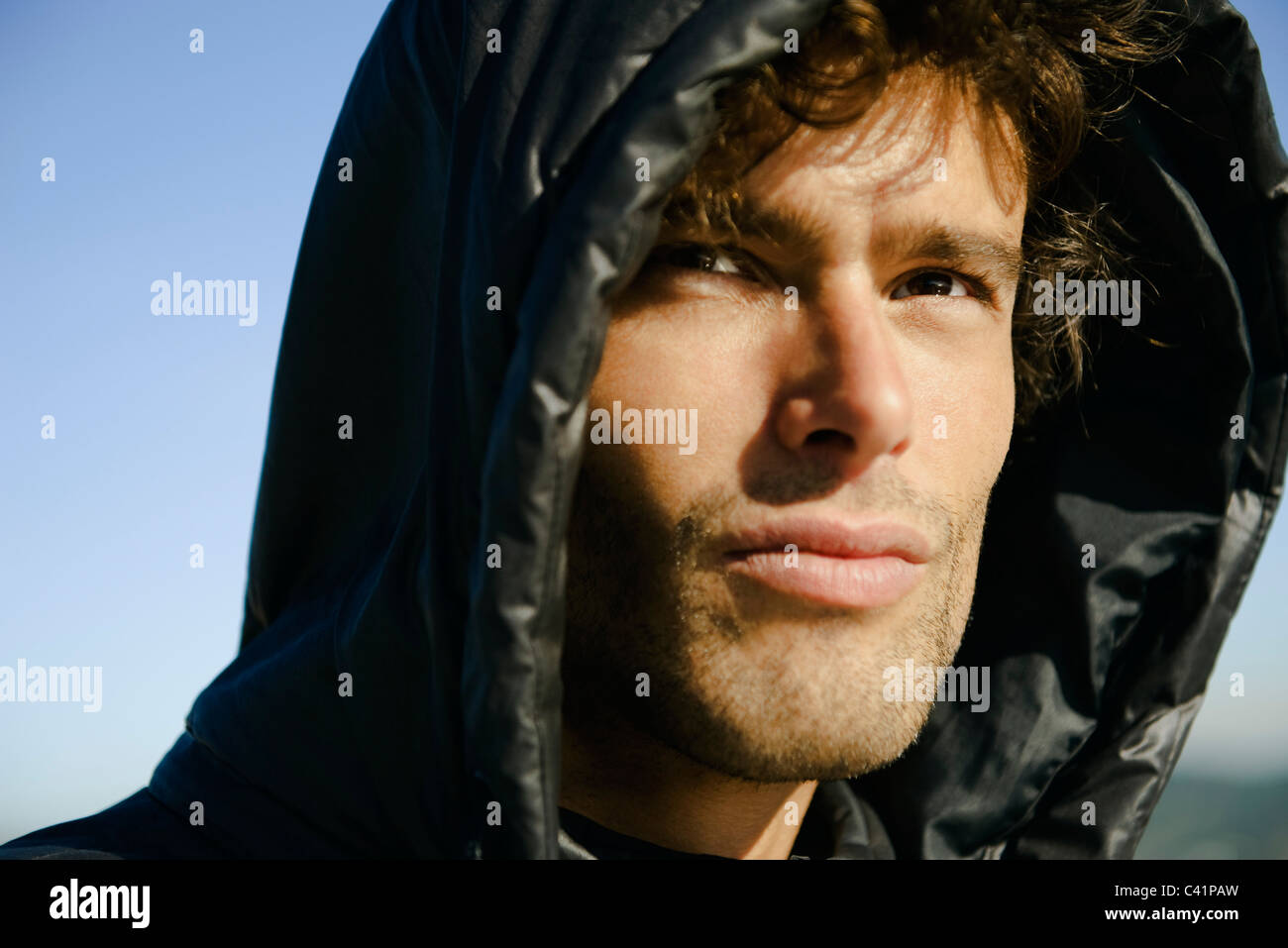Man wearing hood, portrait Stock Photo - Alamy
