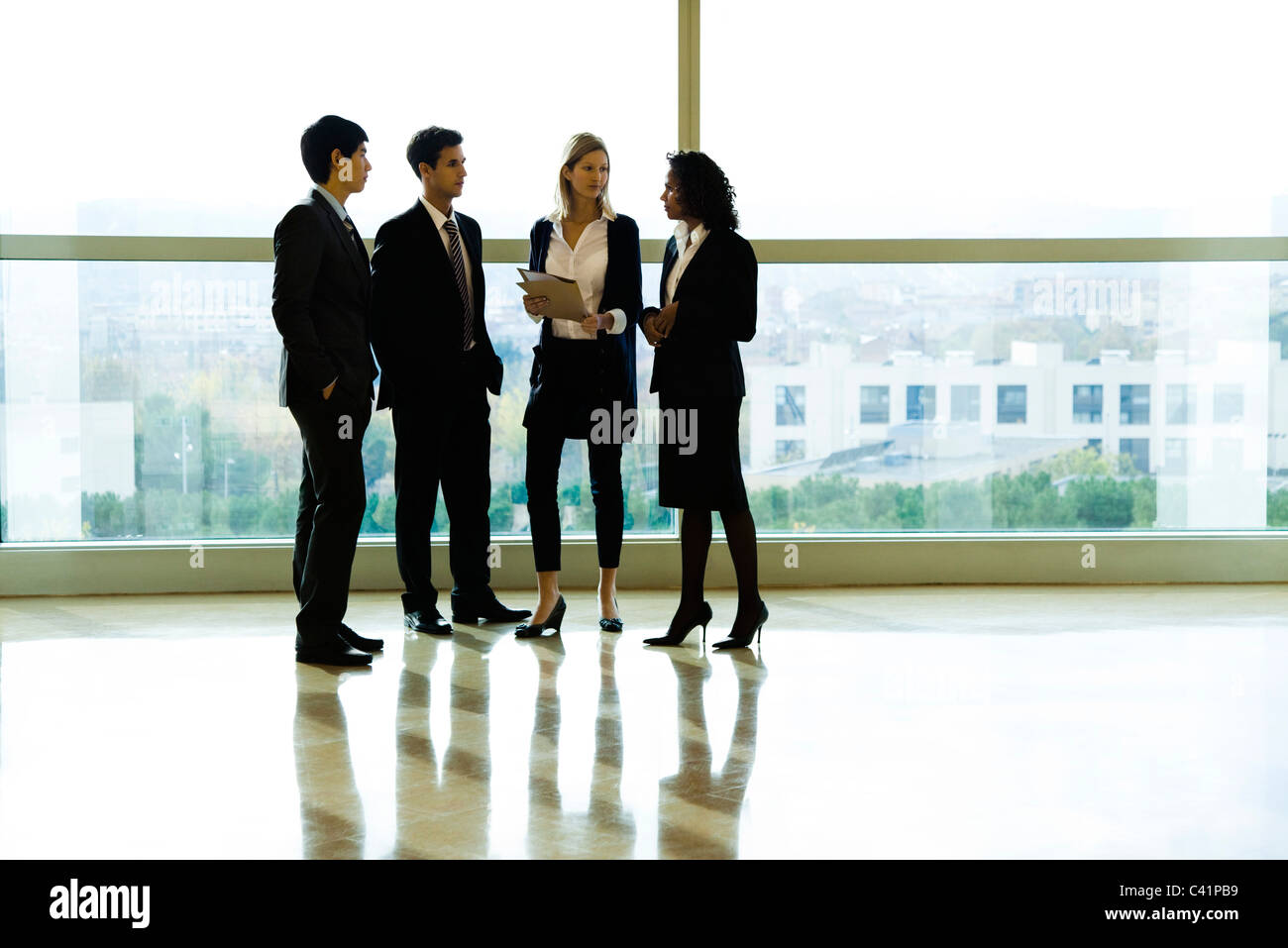 Businessman standing window looking distance hi-res stock photography ...