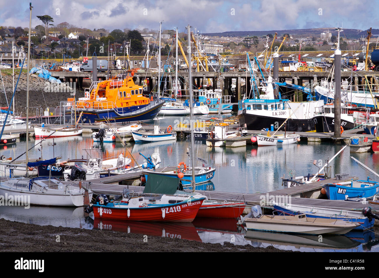 Newlyn harbour at low tide with the RNLI Penlee lifeboat and other ...