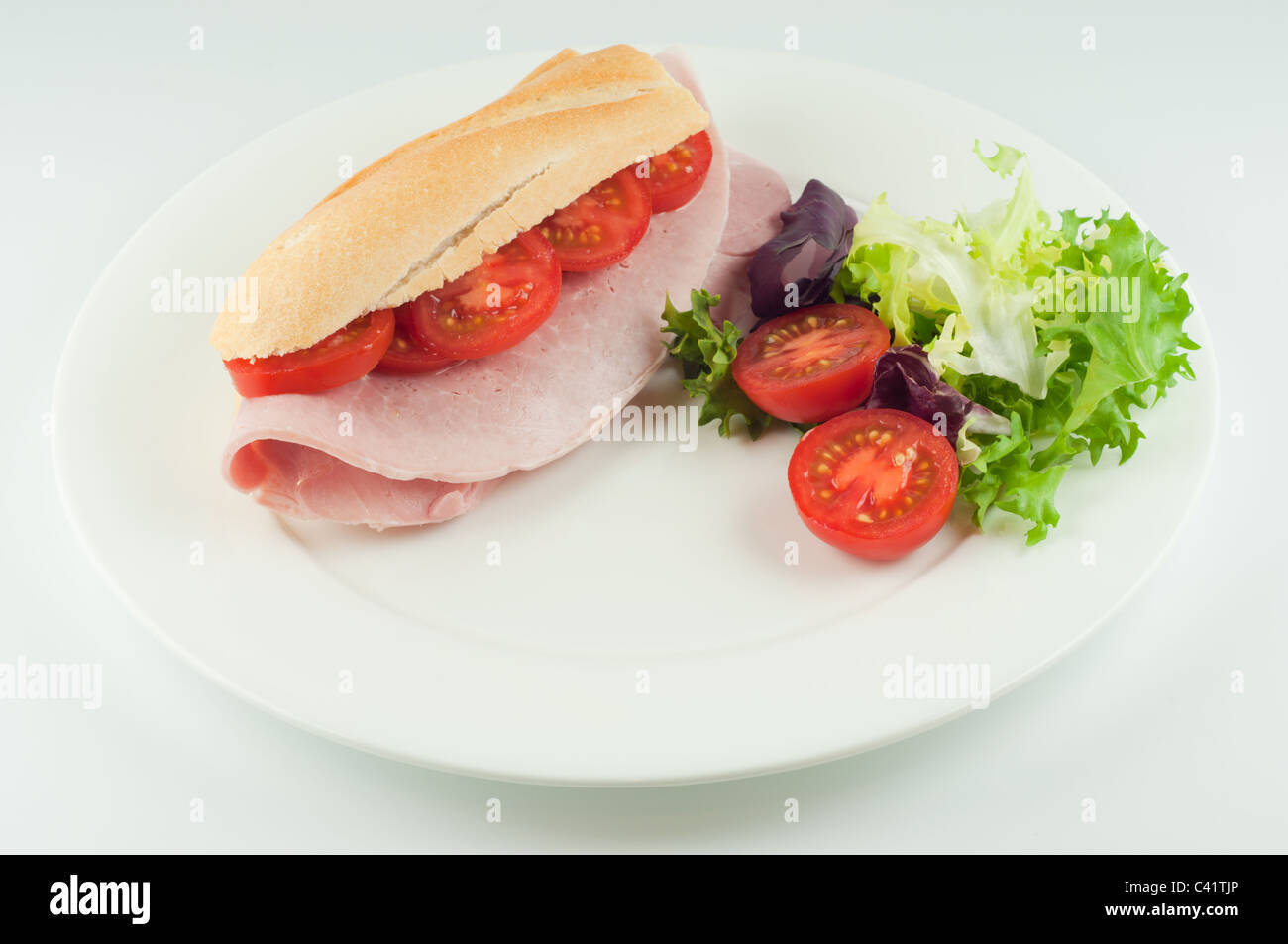 Ham and tomato baguette Stock Photo - Alamy