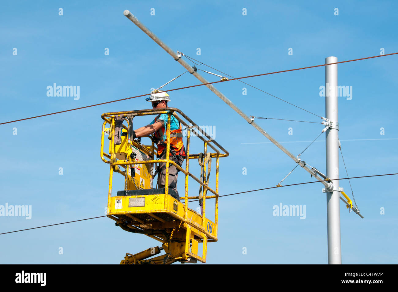Installing the overhead power line equipment on the Manchester ...
