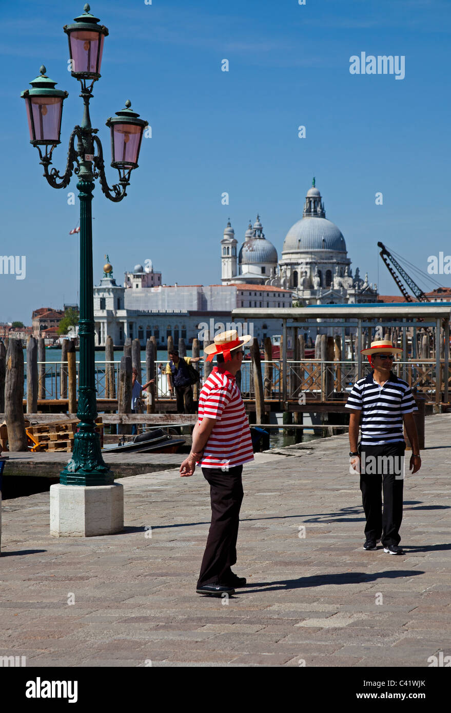 Venice two gondoliers in traditional uniform Italy Europe Stock Photo ...