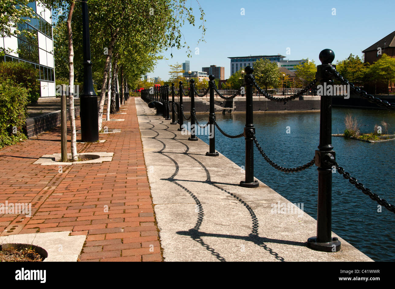 Waterside walkway by the St. Louis Basin, Salford Quays, Manchester, UK ...