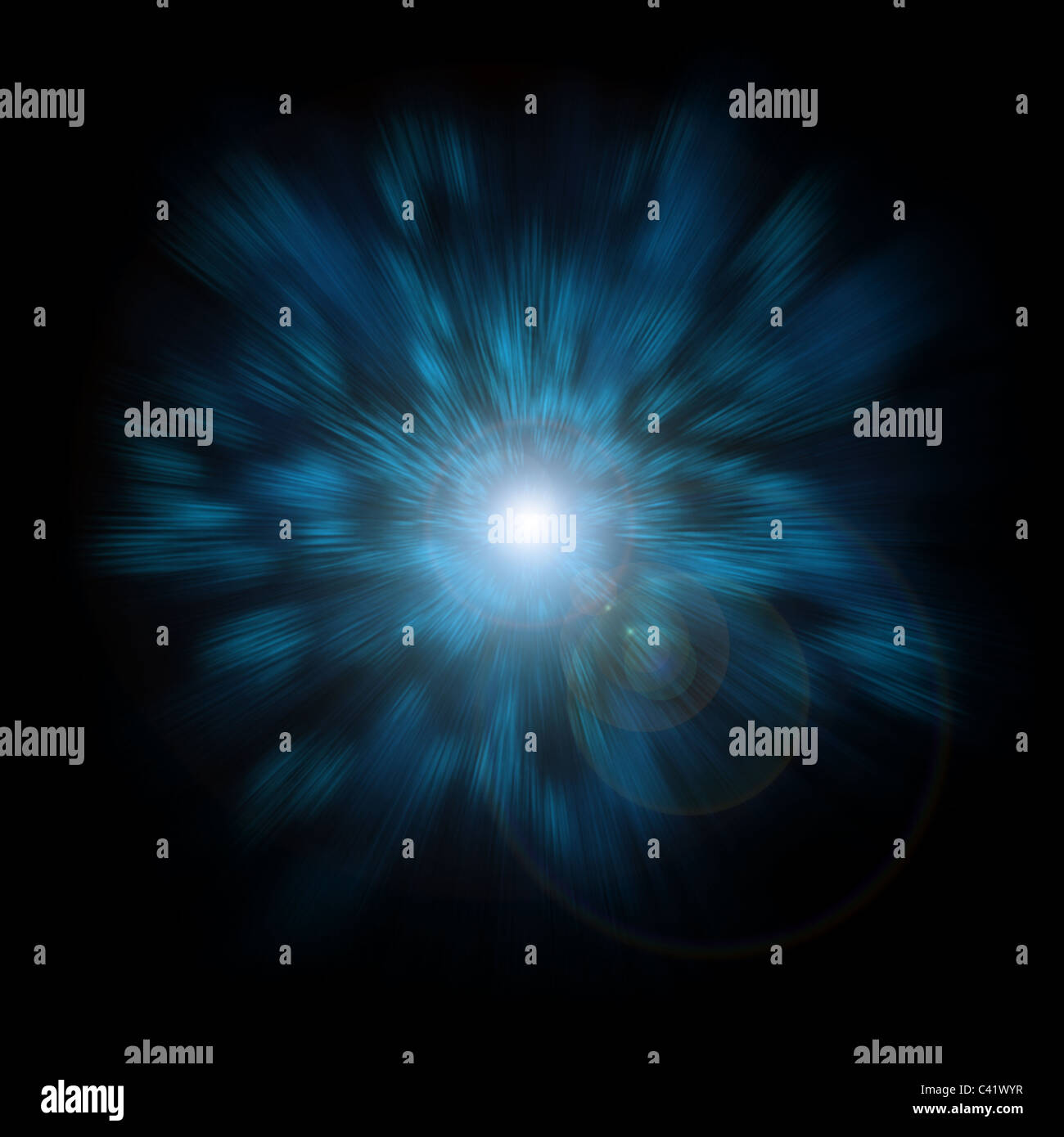 Blue exploding light against a black background Stock Photo - Alamy