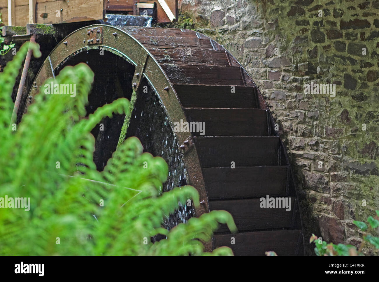 Working water wheel powering a mill Stock Photo - Alamy
