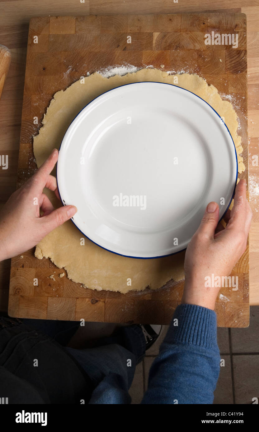 Preparing a pastry case for a pie UK Stock Photo - Alamy