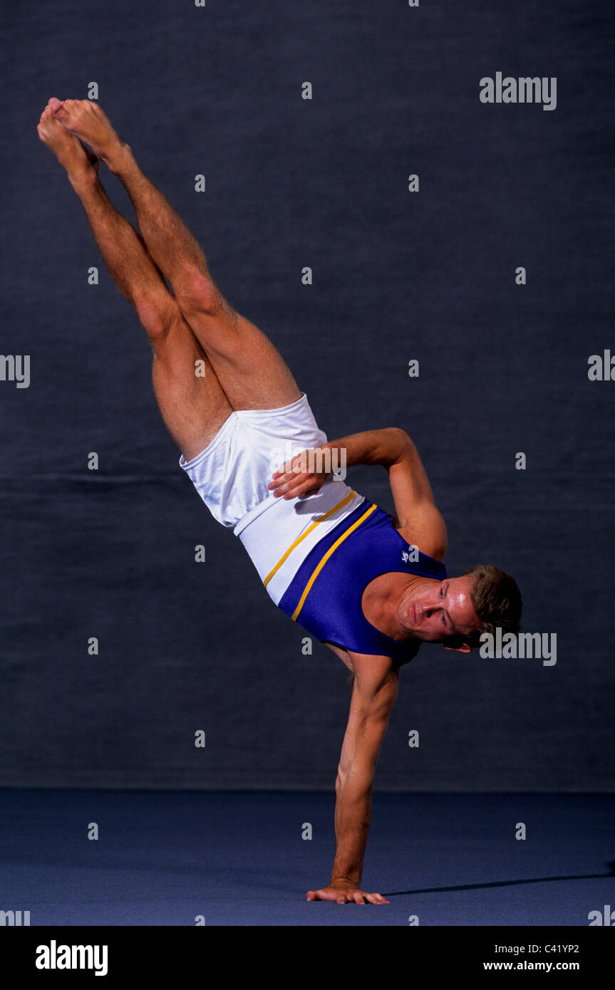 Male gymnast performing on the floor exercise Stock Photo - Alamy