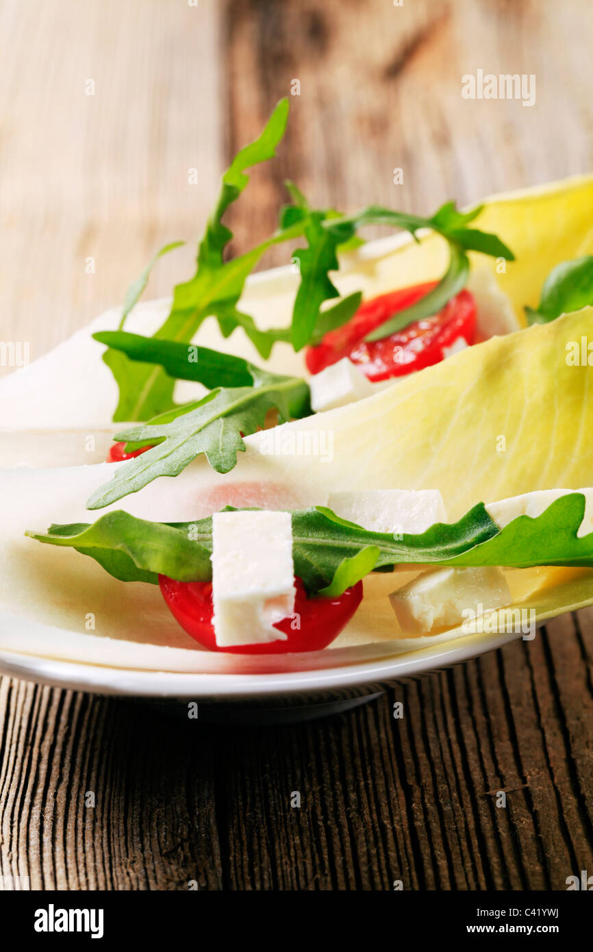 Endive leaves, arugula and diced feta cheese Stock Photo - Alamy