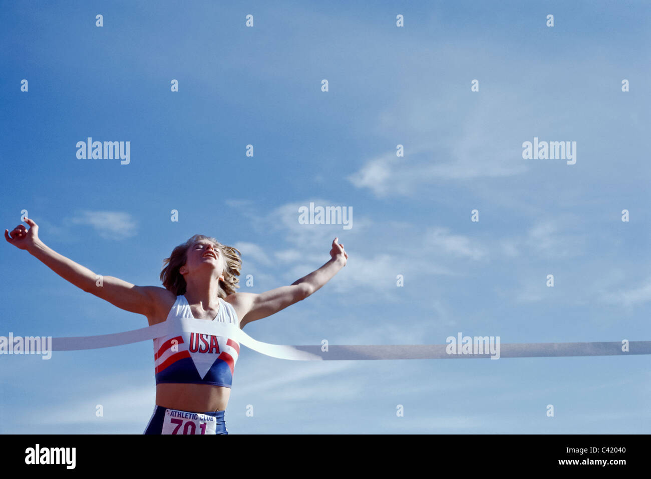 Female runner victorious finish line hi-res stock photography and ...