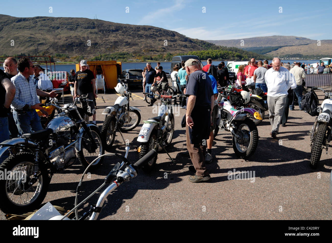 Motorbike display crowd admiring old and new bikes in hot weather ...