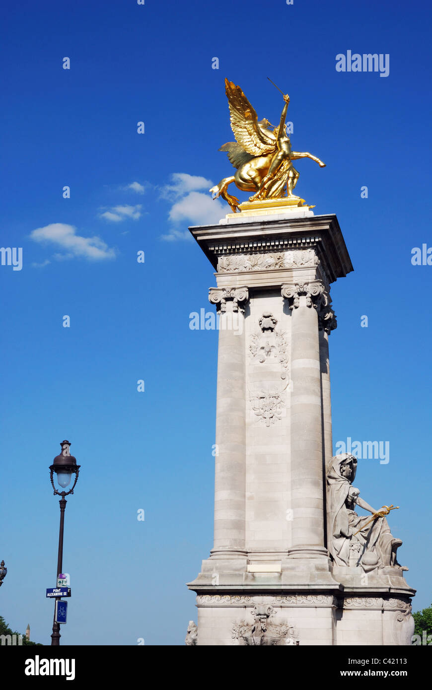 A stone column and statue on Pont Alexandre III in Paris Stock Photo ...