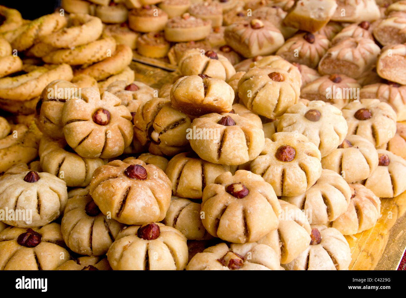 arab sweet pastries cakes stacked bakery with nuts Stock Photo - Alamy