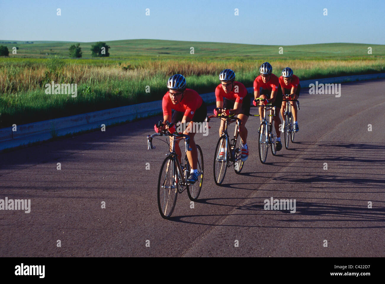 Road cycling team in action Stock Photo - Alamy