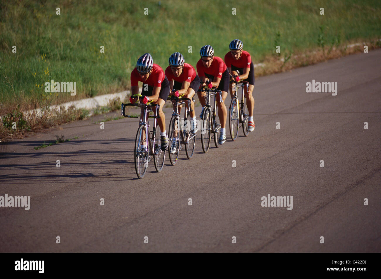 Road cycling team in action Stock Photo - Alamy