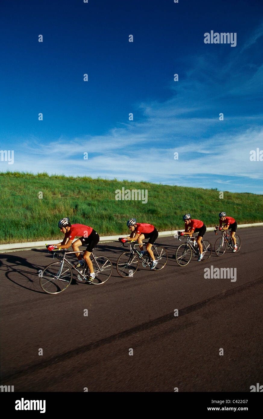 Road cycling team in action Stock Photo - Alamy